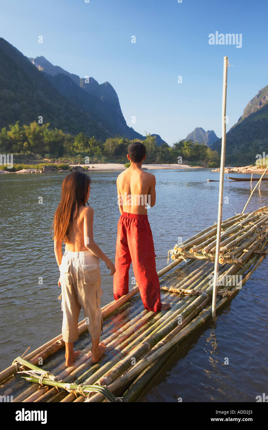 Boy And Girl Standing On Raft Stock Photo - Alamy