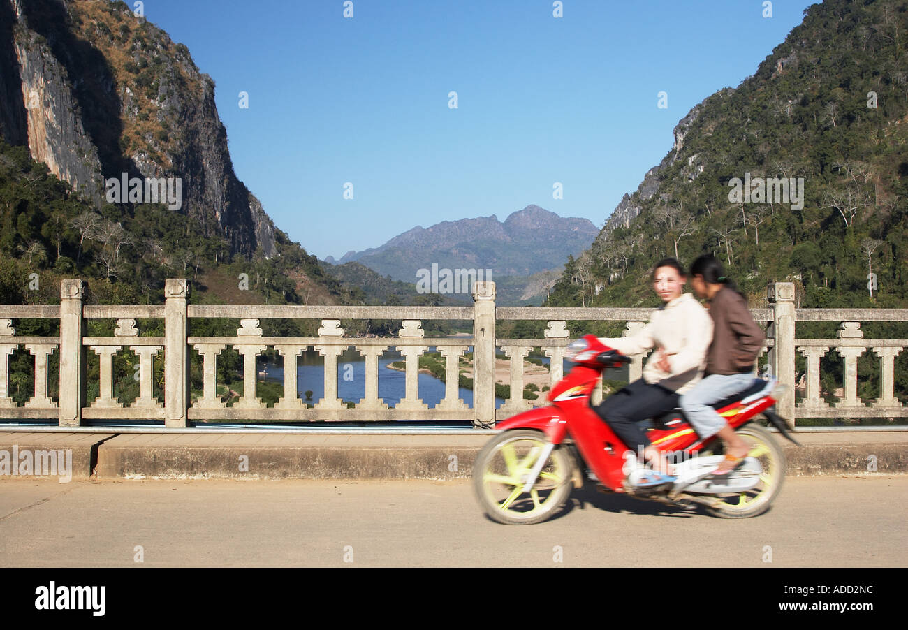 Women Riding Motorcycle Across Bridge Stock Photo - Alamy