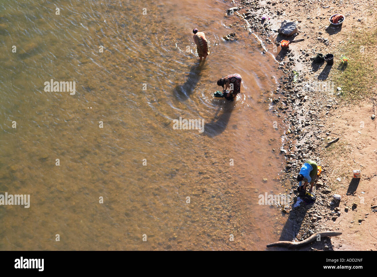 Bird's Eye View Of Women Washing Clothes In Nam Ou River Stock Photo ...