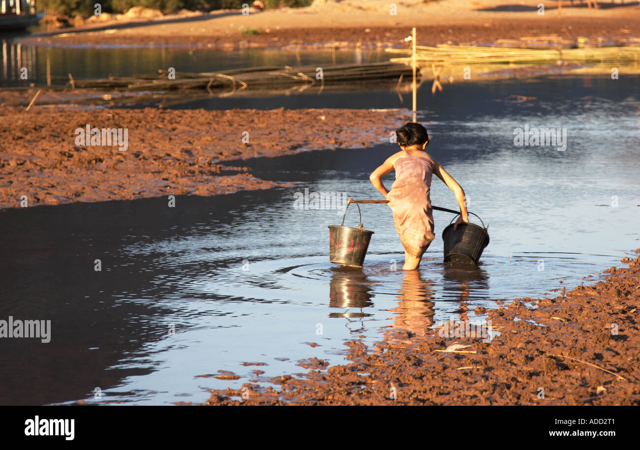 Girl Collecting Water From Nam Ou River Stock Photo - Alamy