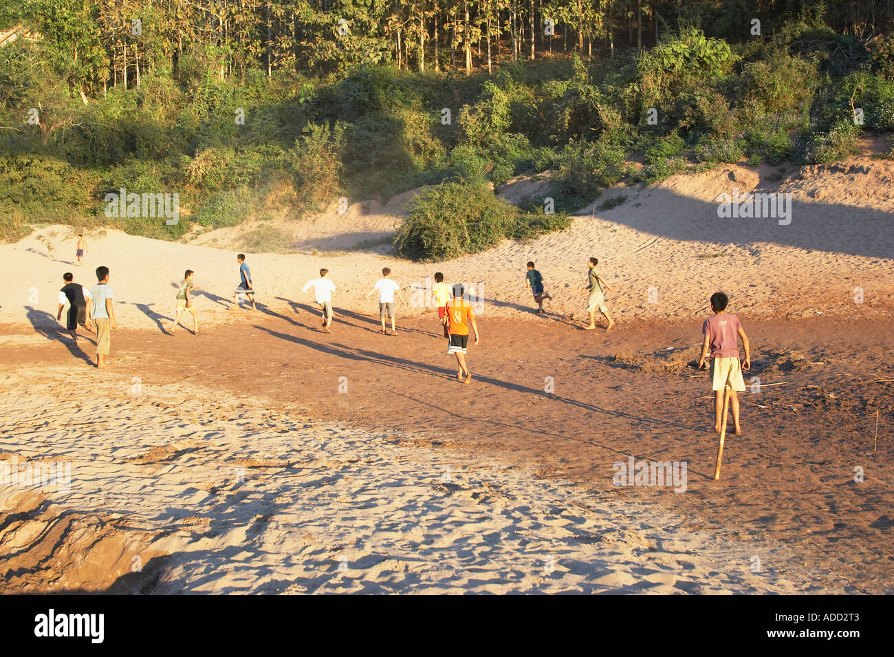 Children Playing Football On Riverbank Stock Photo - Alamy