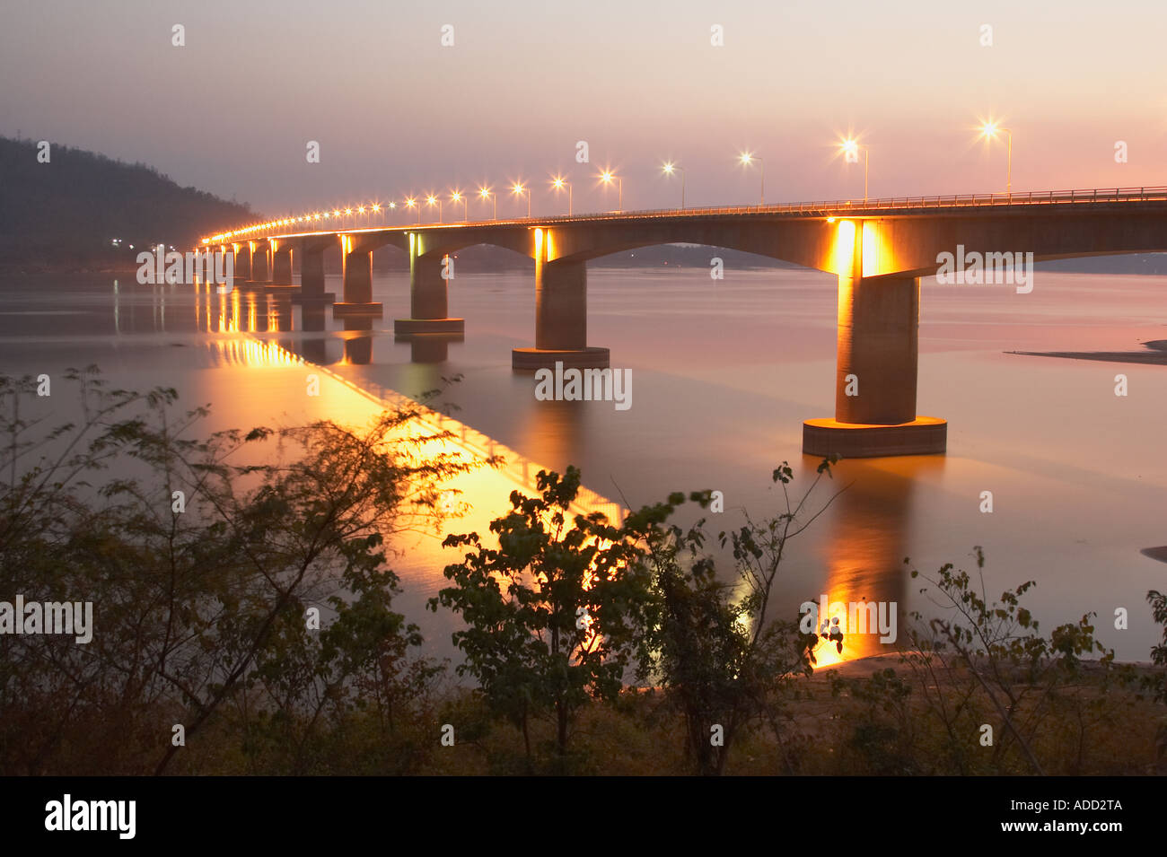 Lao Japanese Bridge Across Mekong River At Sunset Stock Photo - Alamy