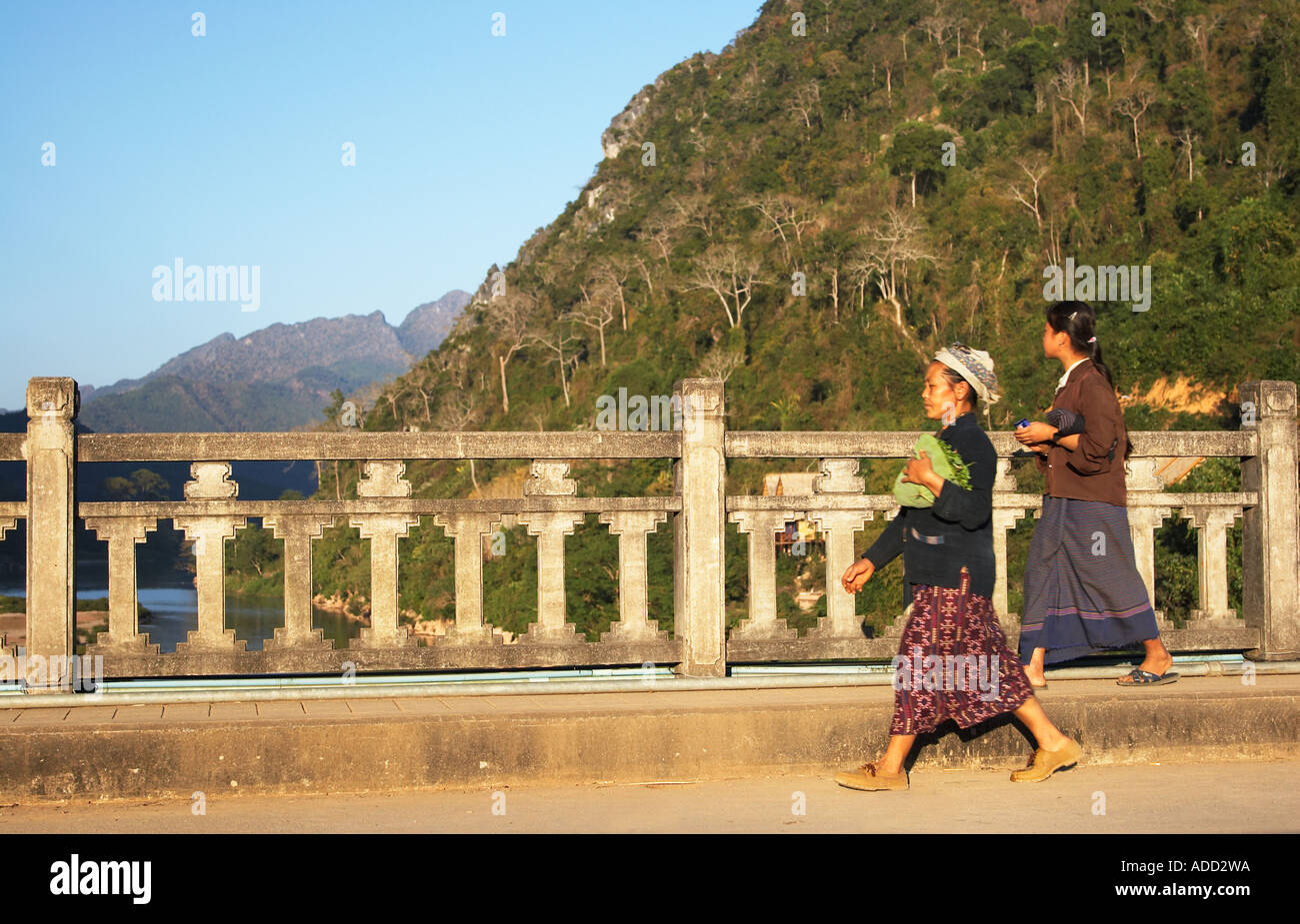 Women Walking Across Bridge Stock Photo - Alamy