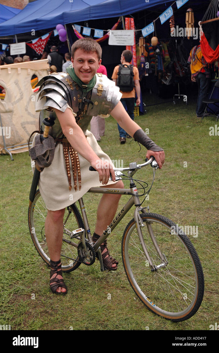 Man in roman soldier costume sitting on bike Stock Photo - Alamy