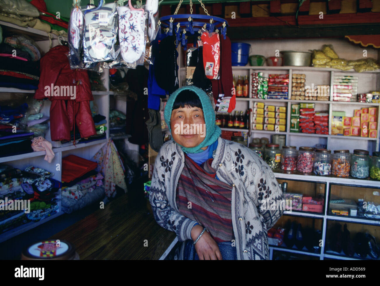 Woman storekeeper in a general store in Bhutan Stock Photo - Alamy