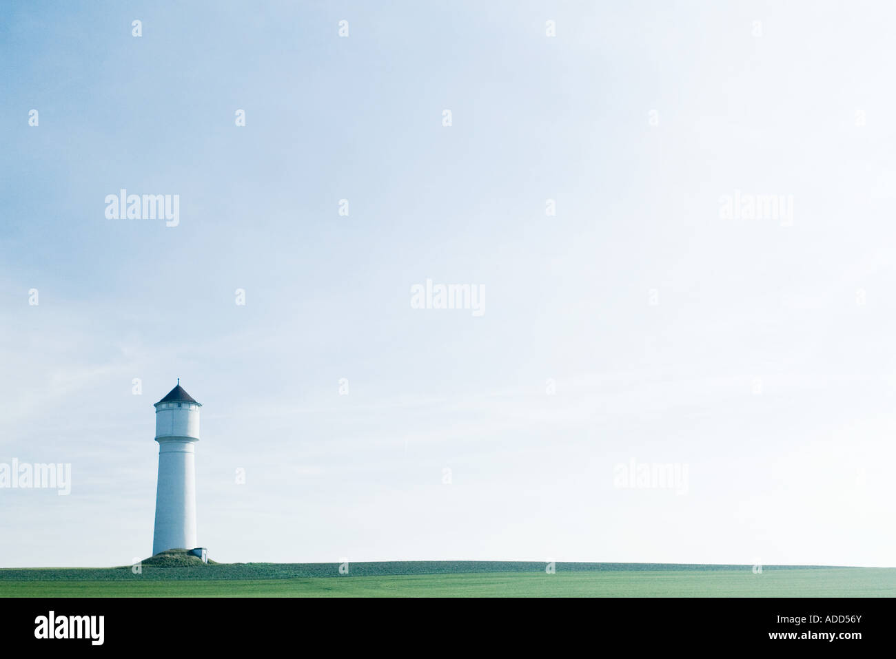Tower in green field Stock Photo - Alamy