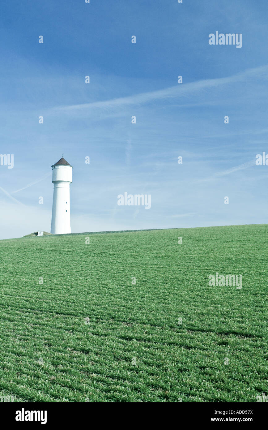 Tower in green field Stock Photo - Alamy