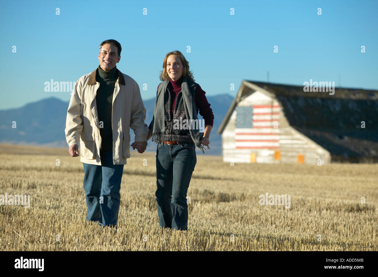 Man walking through field touching hi-res stock photography and images ...