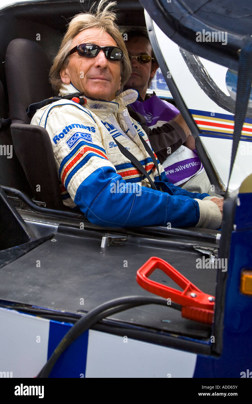 Derek Bell waiting to display a classic Rothmans 956 Porsche race ...