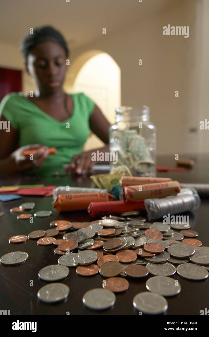 Girl counting change hi-res stock photography and images - Alamy