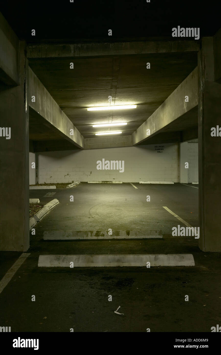 Desolate parking garage at night Stock Photo - Alamy