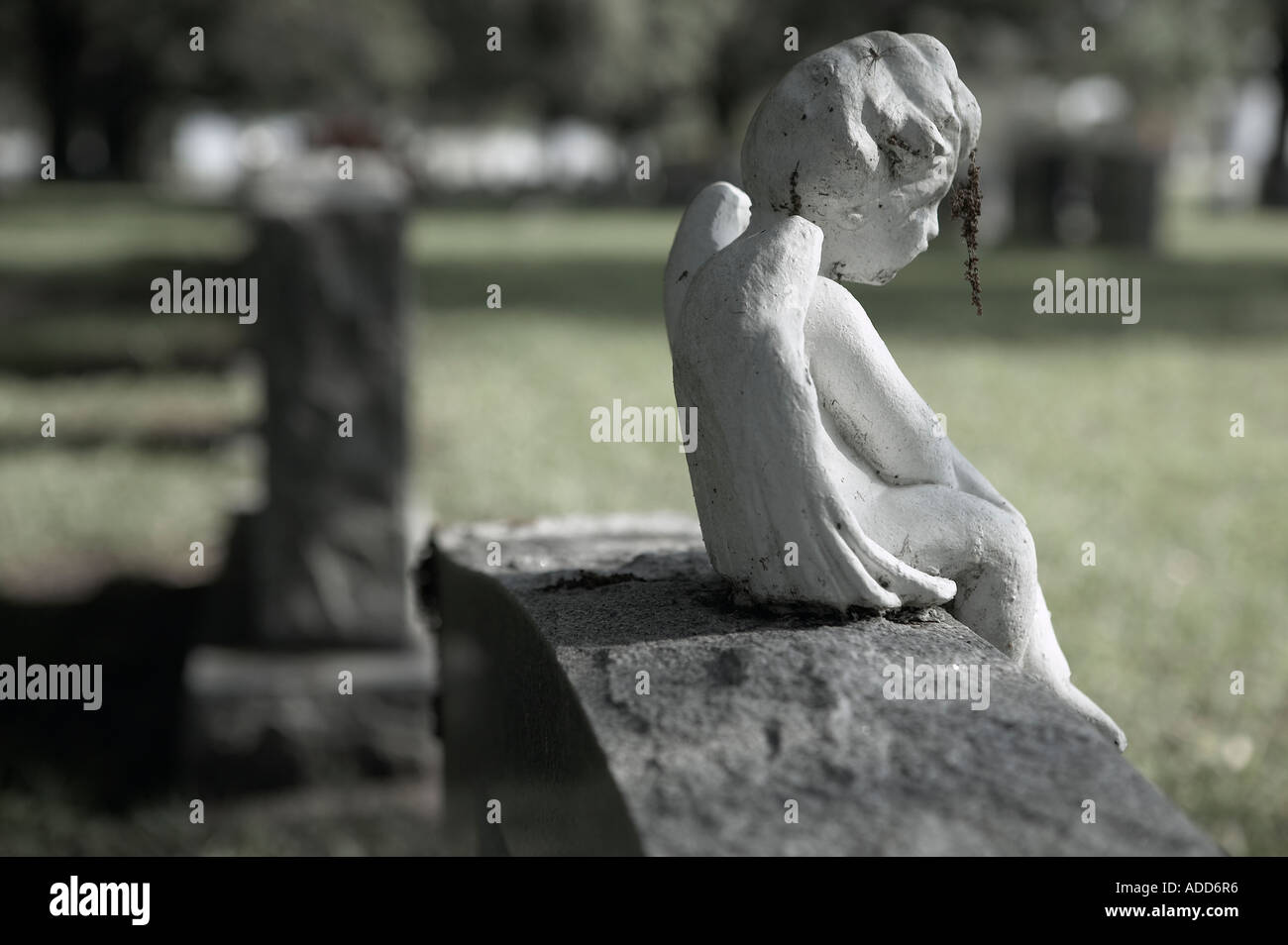 Headstone with angel statue in a cemetery Stock Photo - Alamy