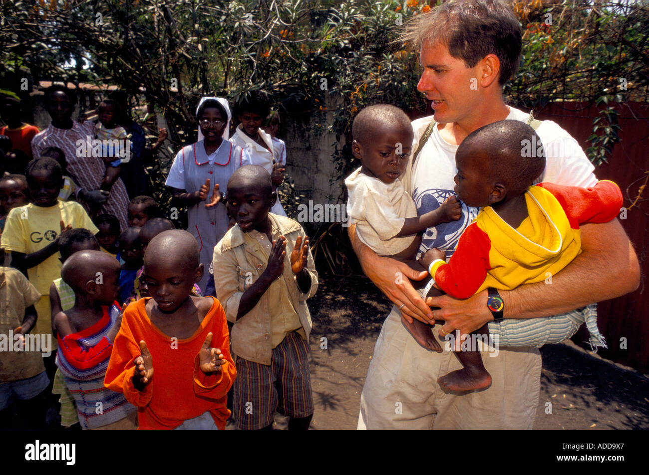 Bhumba Goma, Democratic Republic Of Congo. A Unicef aid worker collects ...