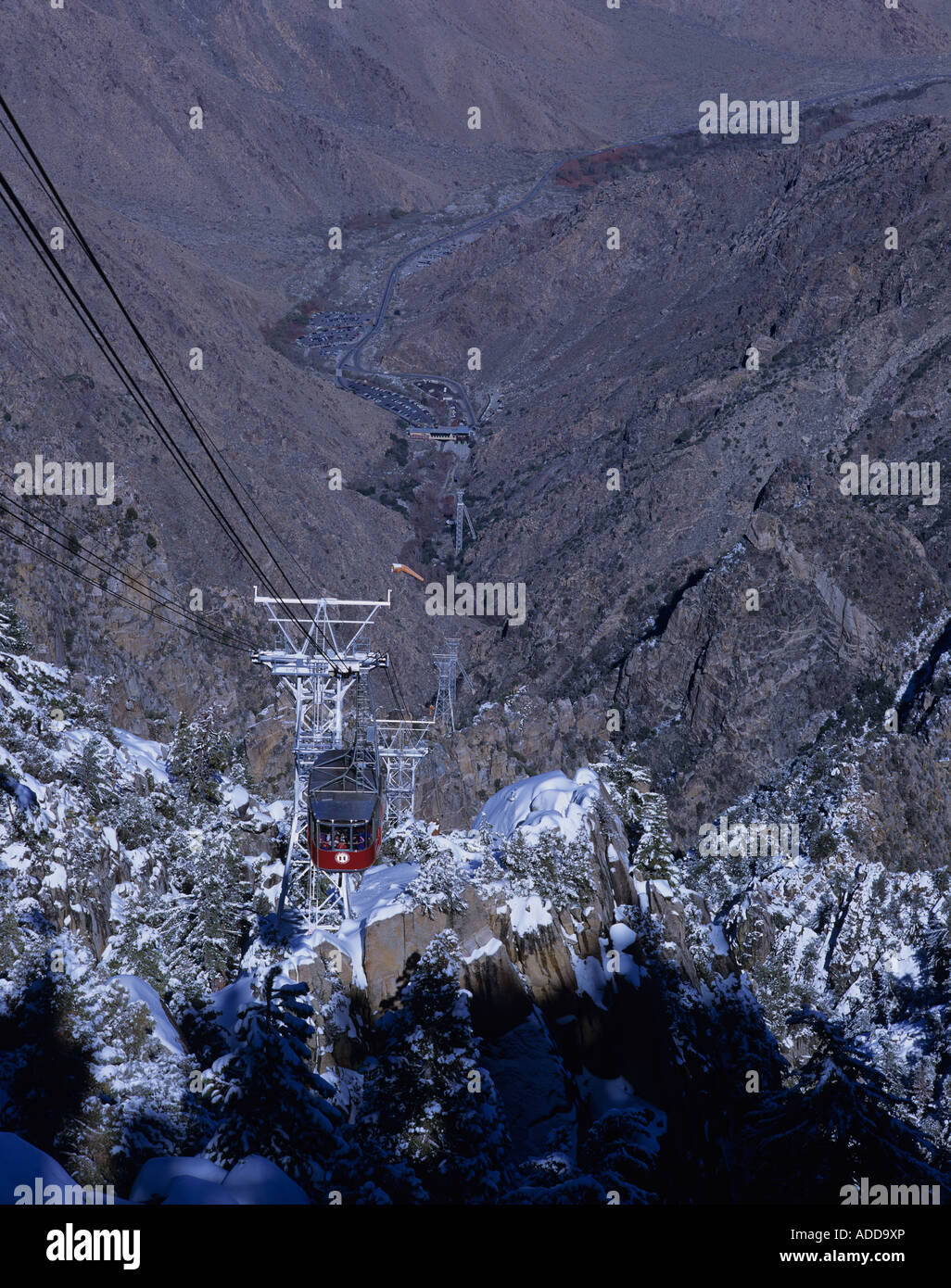 Aerial tramway moving up on cables from the valley floor up to Mount ...