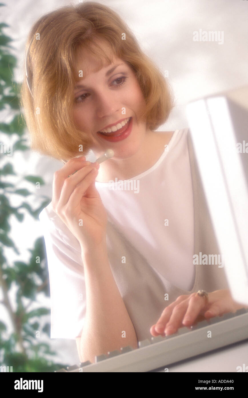 Female telecommunications operator talking with headset Stock Photo - Alamy