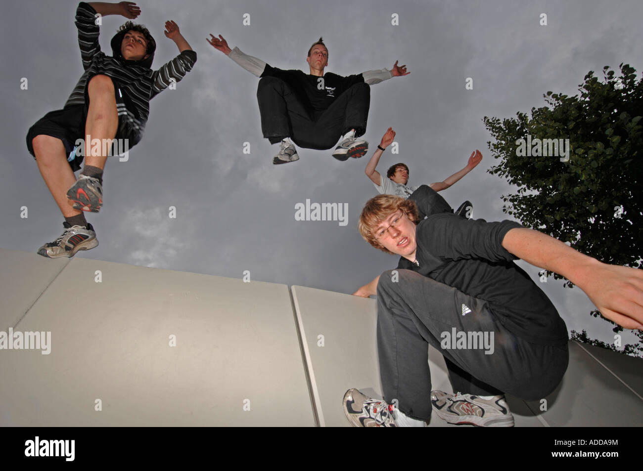 Young Group performing the new and risky urban sport called Le Parkour ...