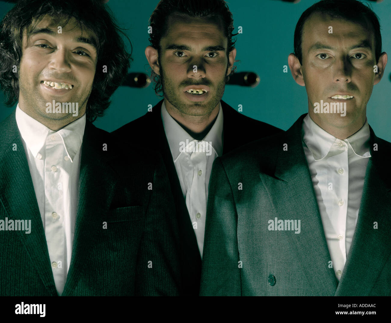 3 men looking glum Stock Photo - Alamy