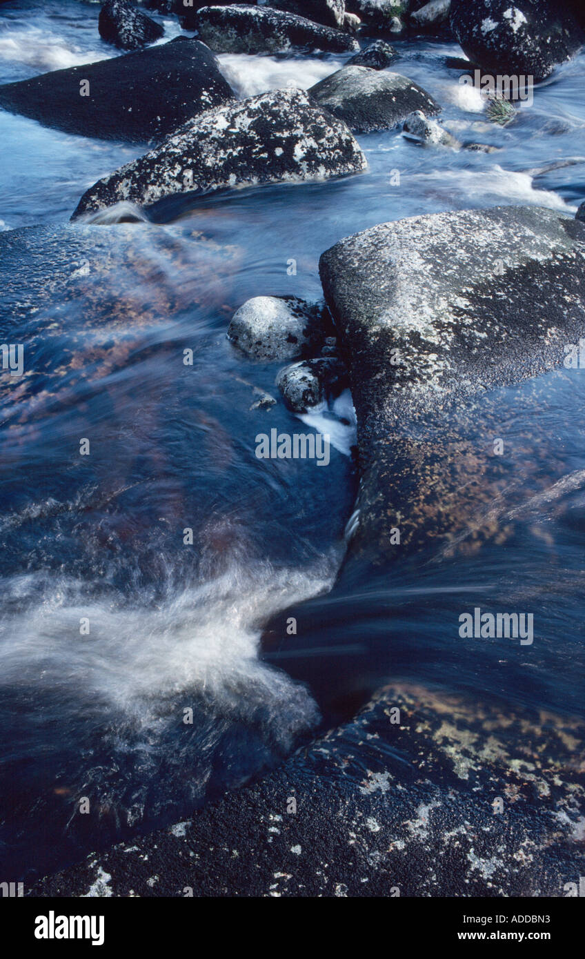 Black and white rocks and flowing water in West Dart River, Dartmoor ...