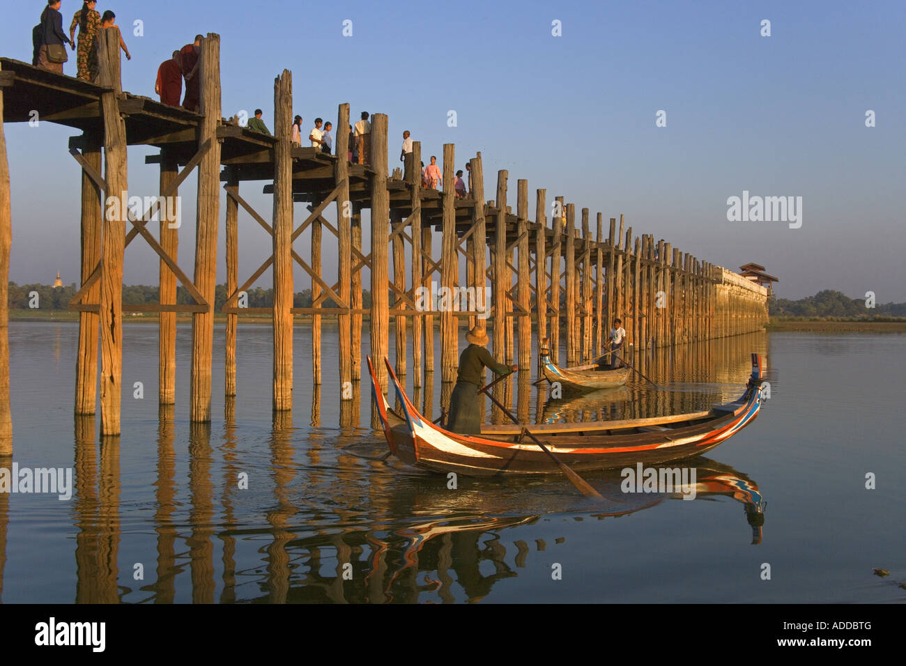 Boat with U Bein teak bridge across Taungthaman Lake Amarapura near ...