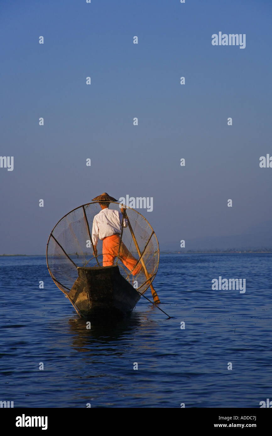 Intha fisherman rowing boat with one leg and fishing Inle Lake Myanmar ...