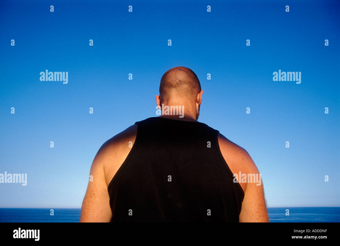 large man looking out to sea Stock Photo - Alamy