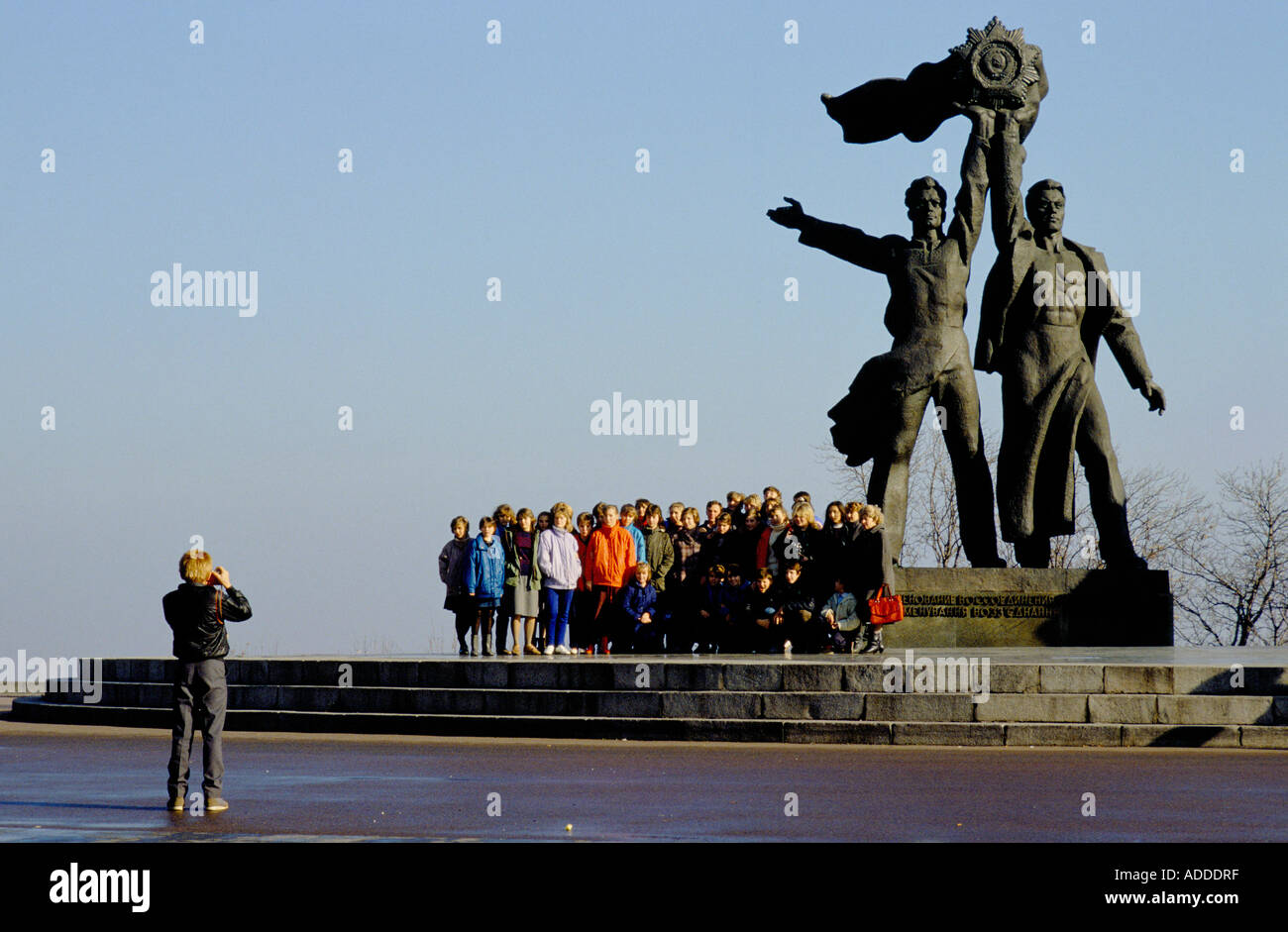A group of students stand beside the Statue of Friendship in Kiev, Oct ...