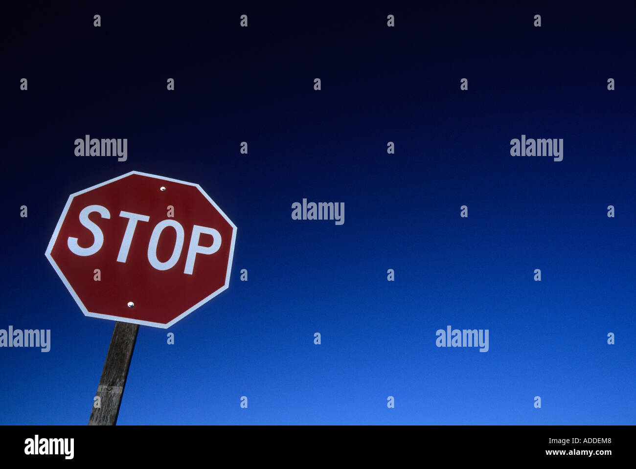 Stop sign against a blue sky Stock Photo - Alamy