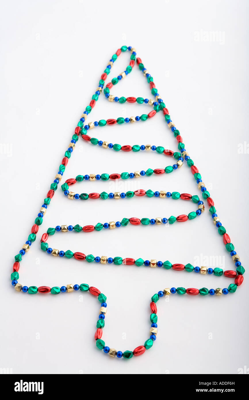Closeup of Christmas tree made with colorful bead strands on white ...
