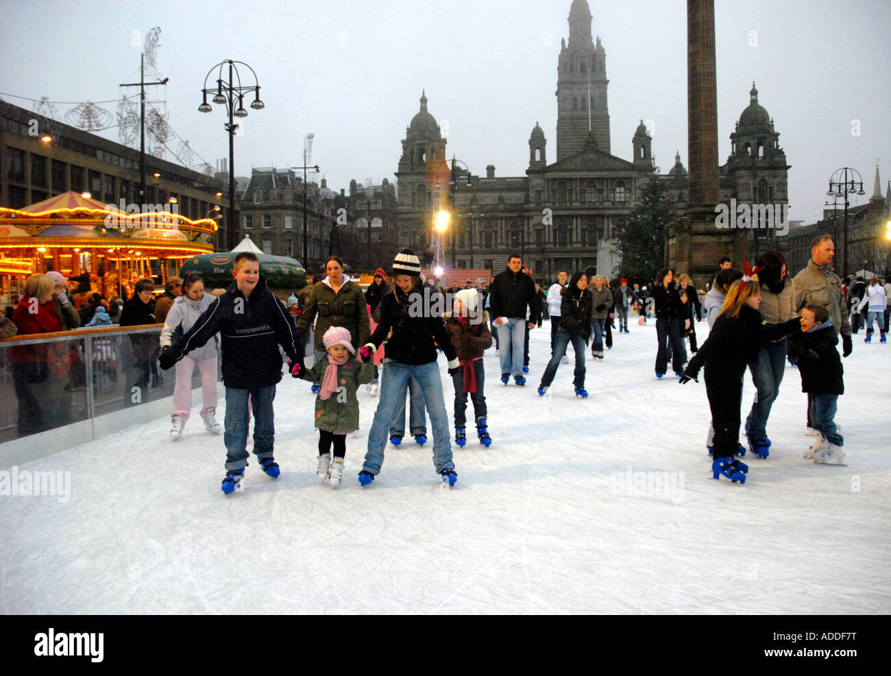 Ice Skating on Outdoor Ice Rink, George Square. City Chambers in ...