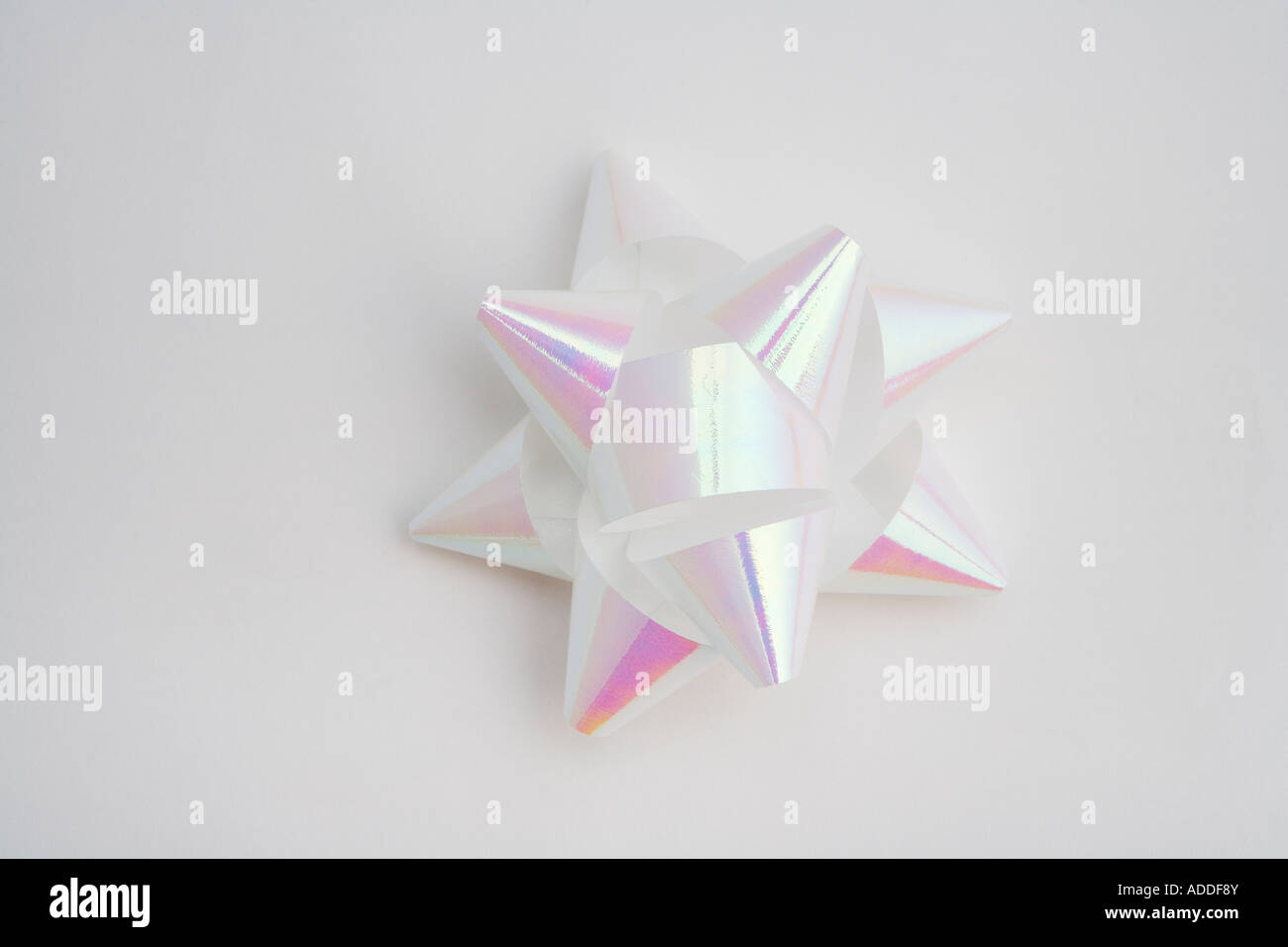 Shiny white Christmas gift bow on white background studio portrait ...