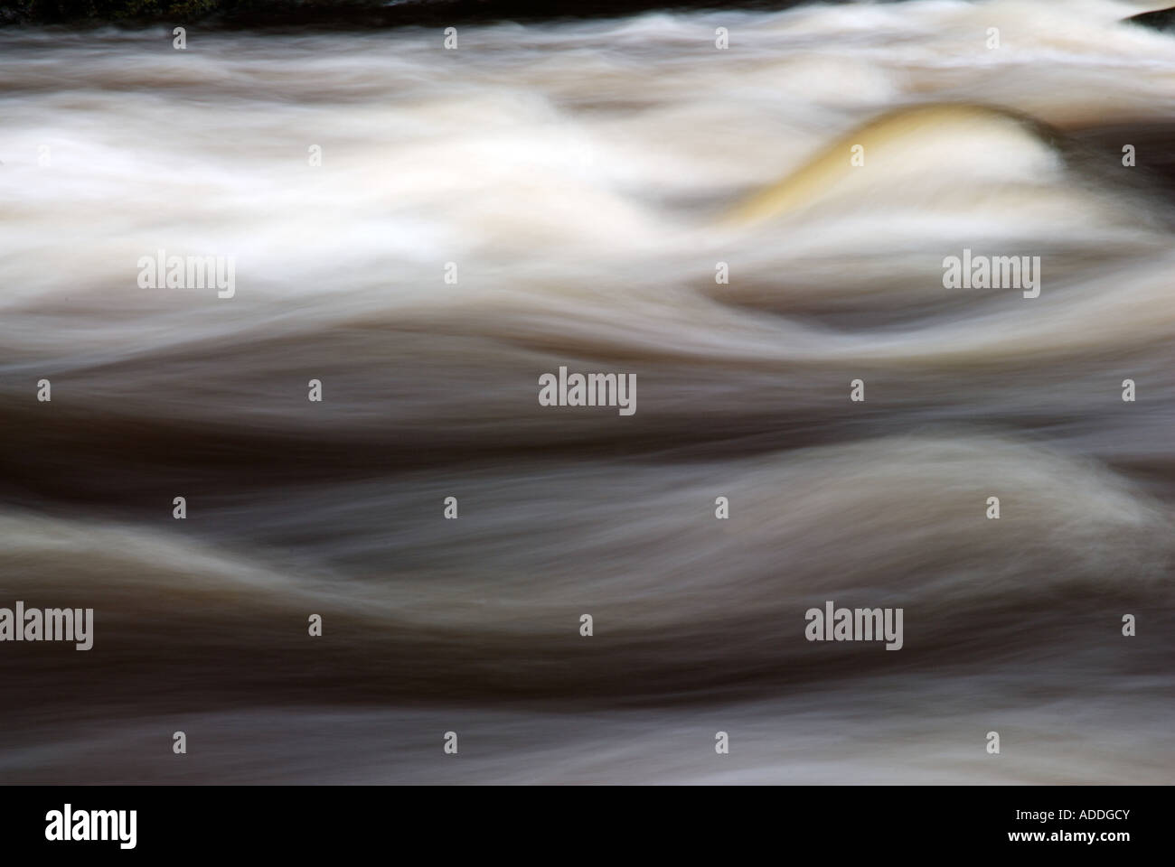 Rushing river flowing water abstract Stock Photo - Alamy