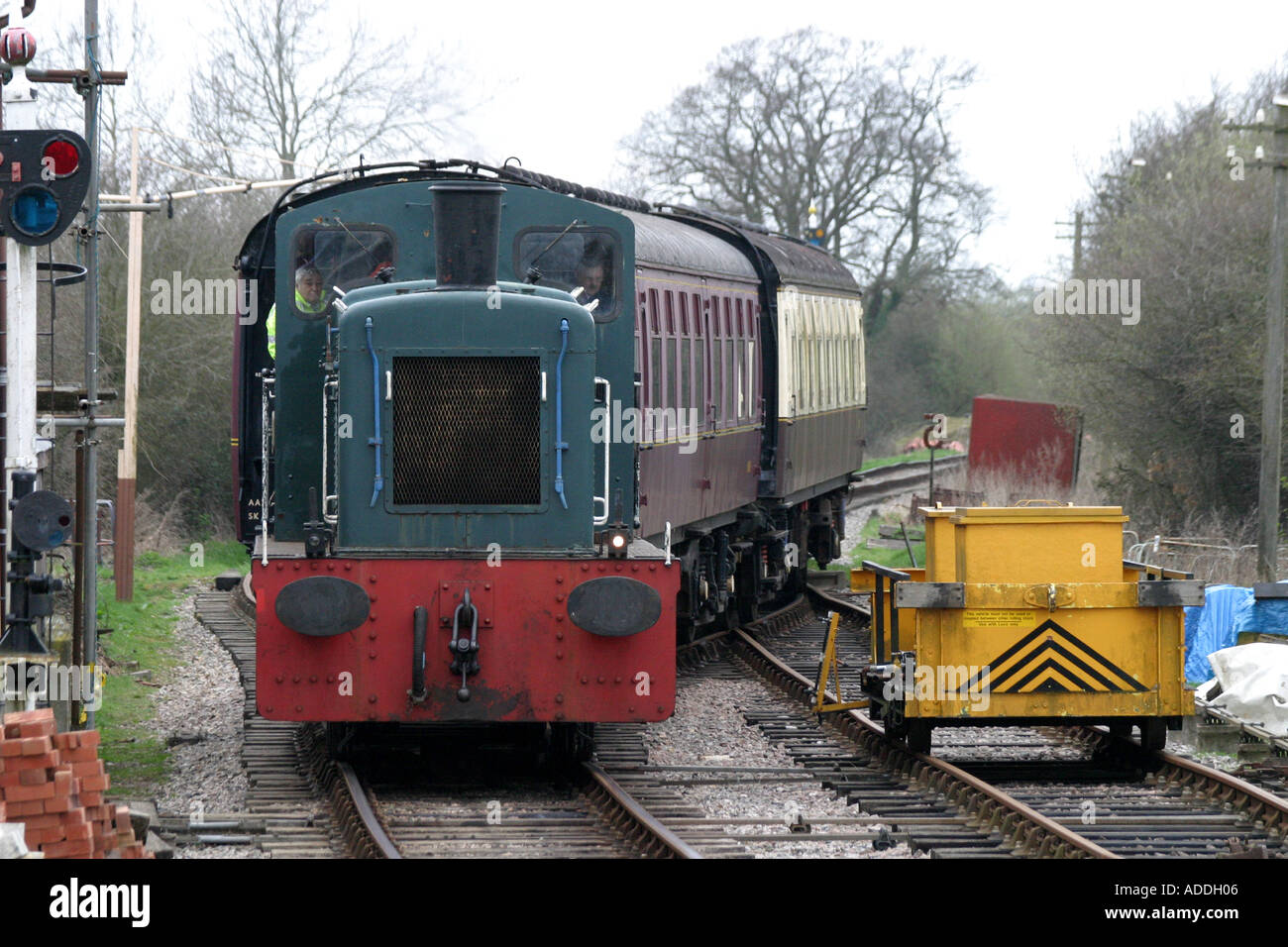 Train pulls into platform of preserved railway station Stock Photo - Alamy
