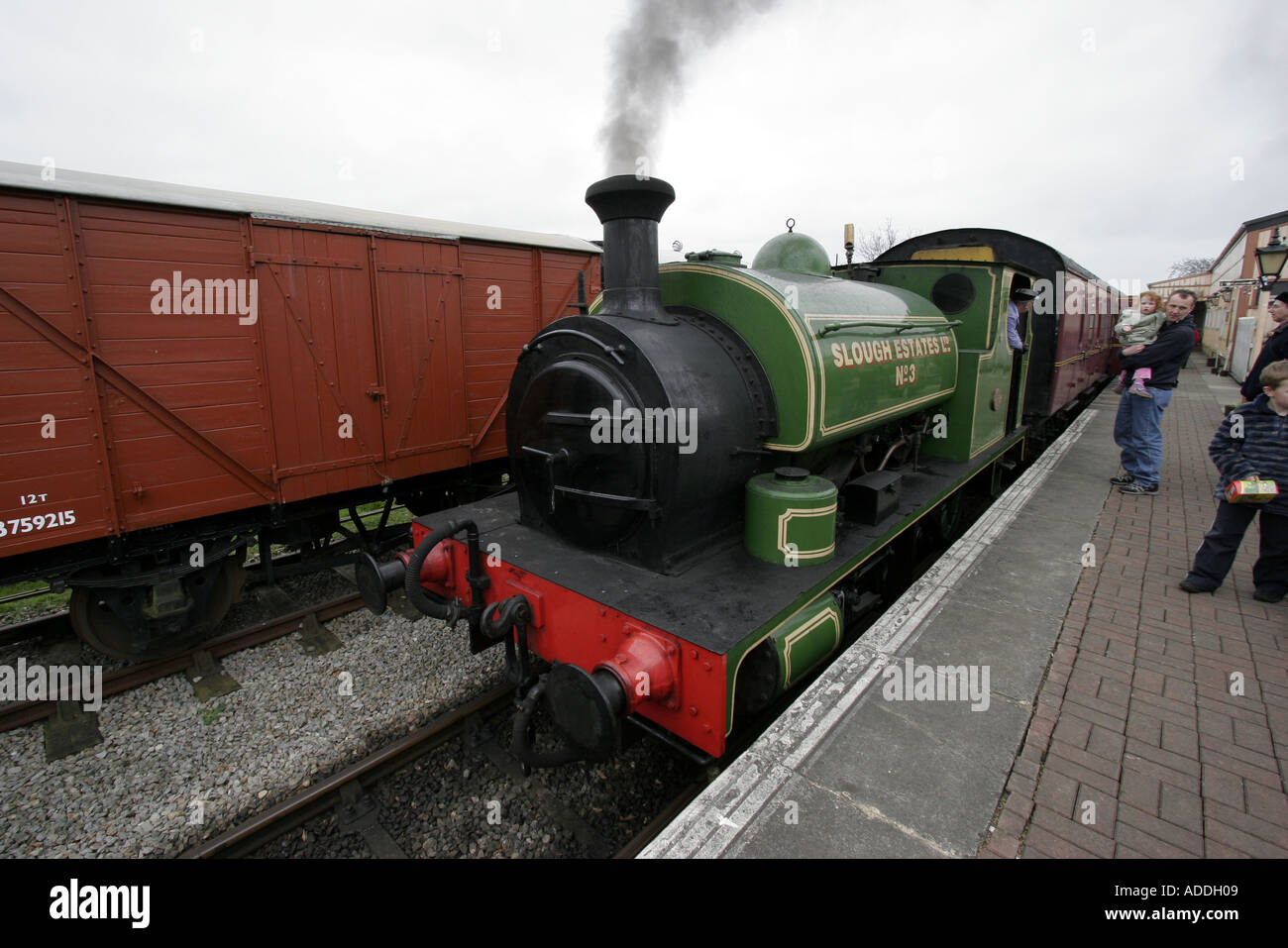 Train pulls into platform of preserved railway station Stock Photo - Alamy