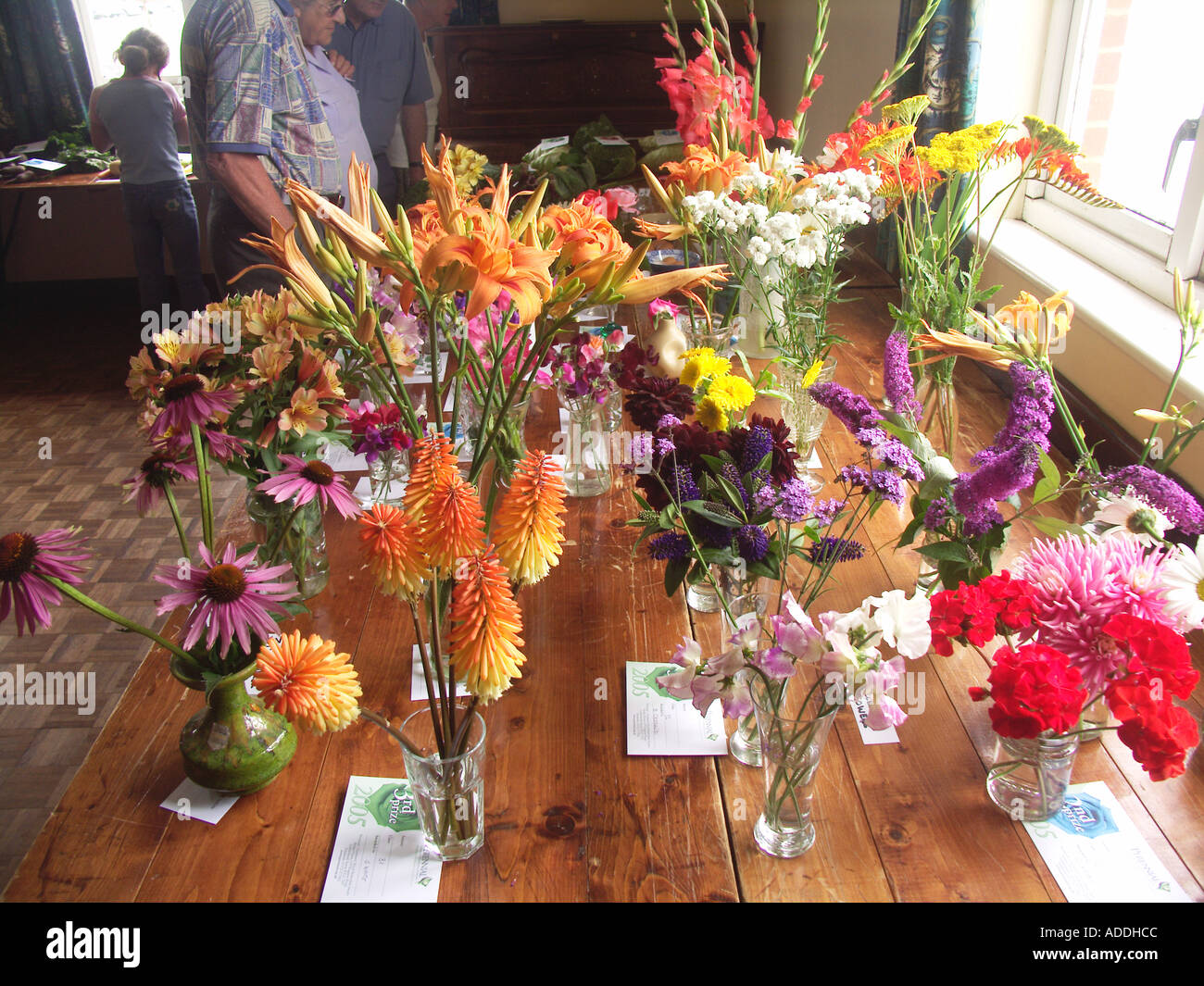 Display of flowers in vases village show Stock Photo - Alamy
