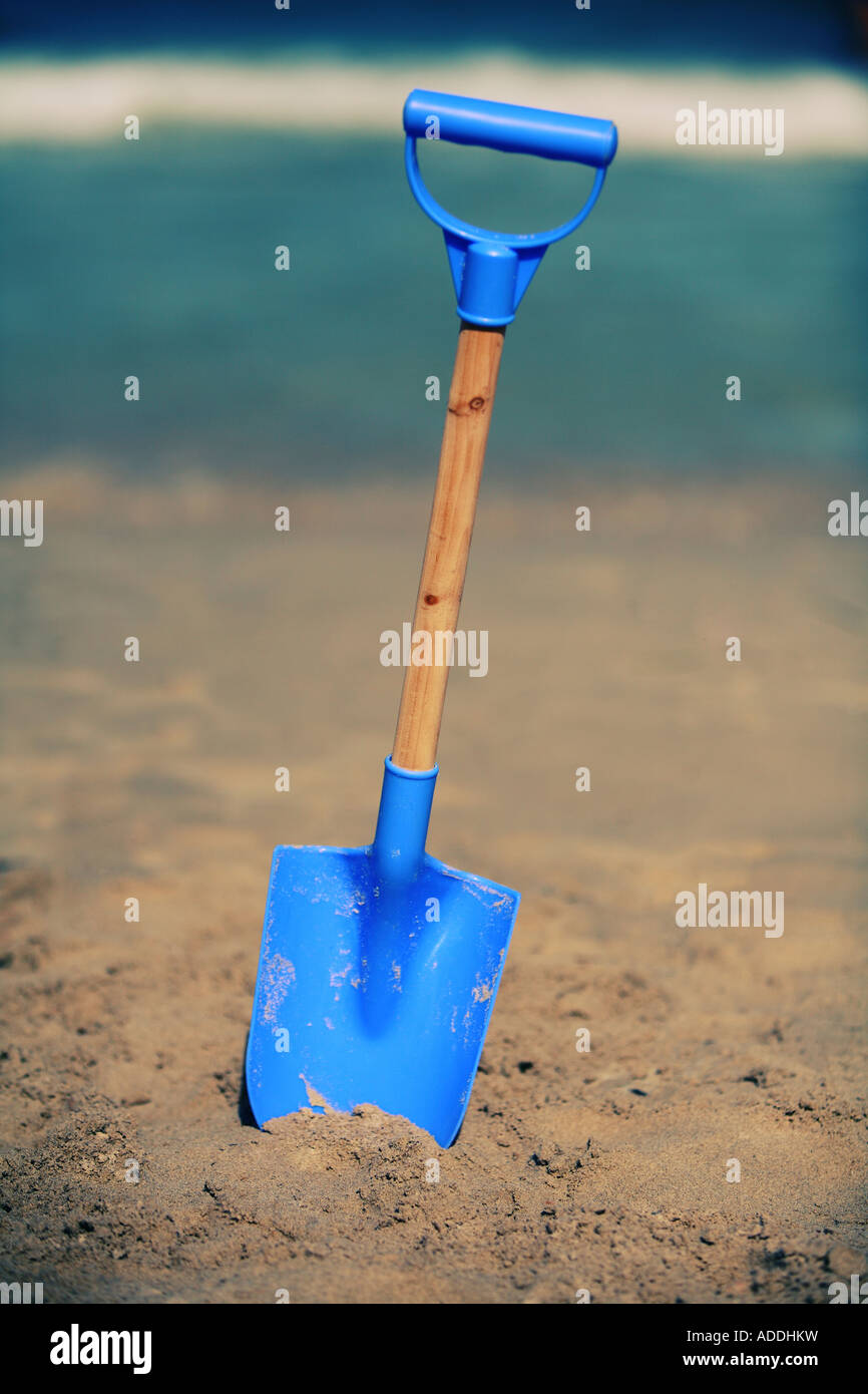 Blue spade on the beach Stock Photo - Alamy