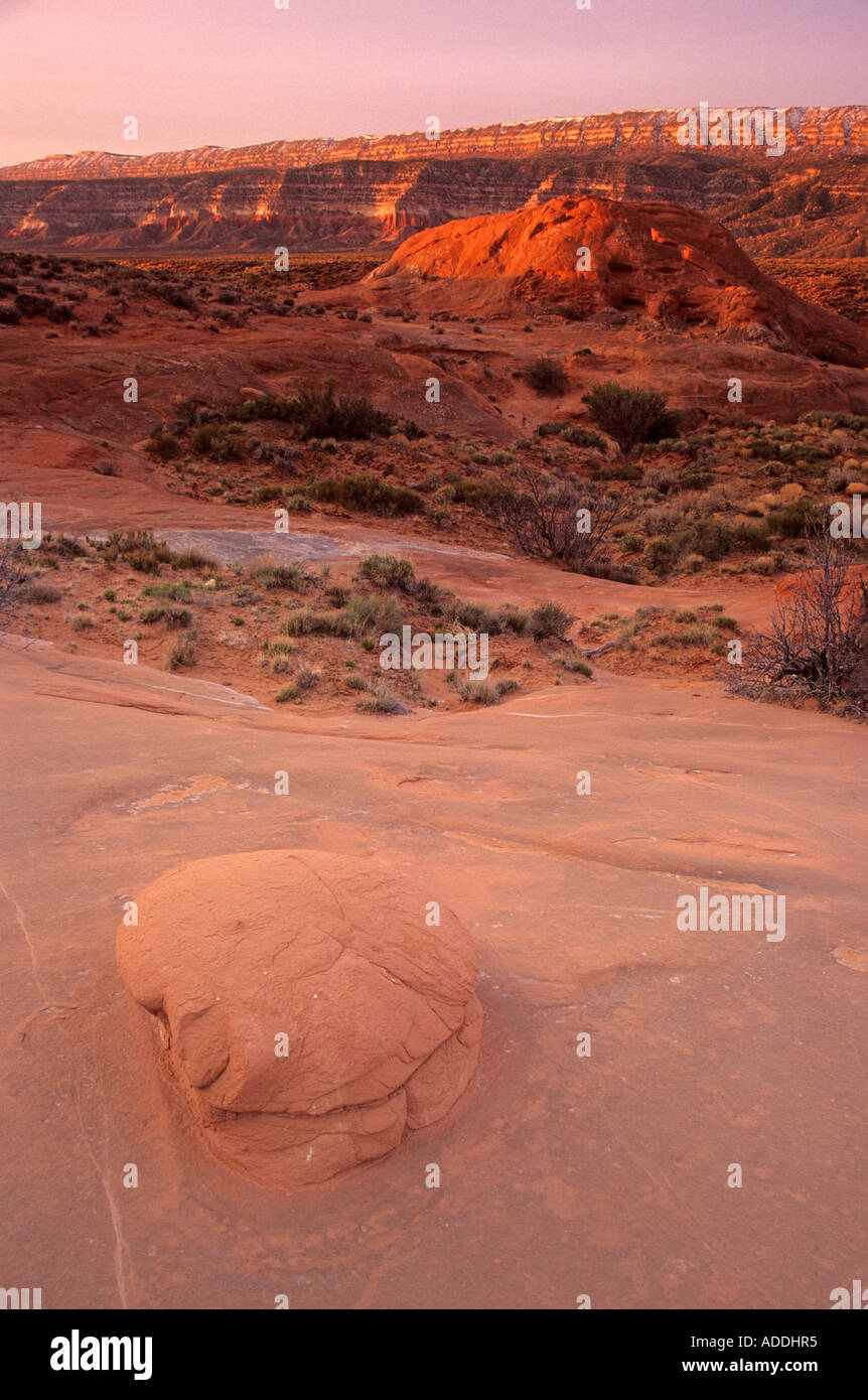 Sunrise colors sandstone landscape along the Straight Cliffs south of ...