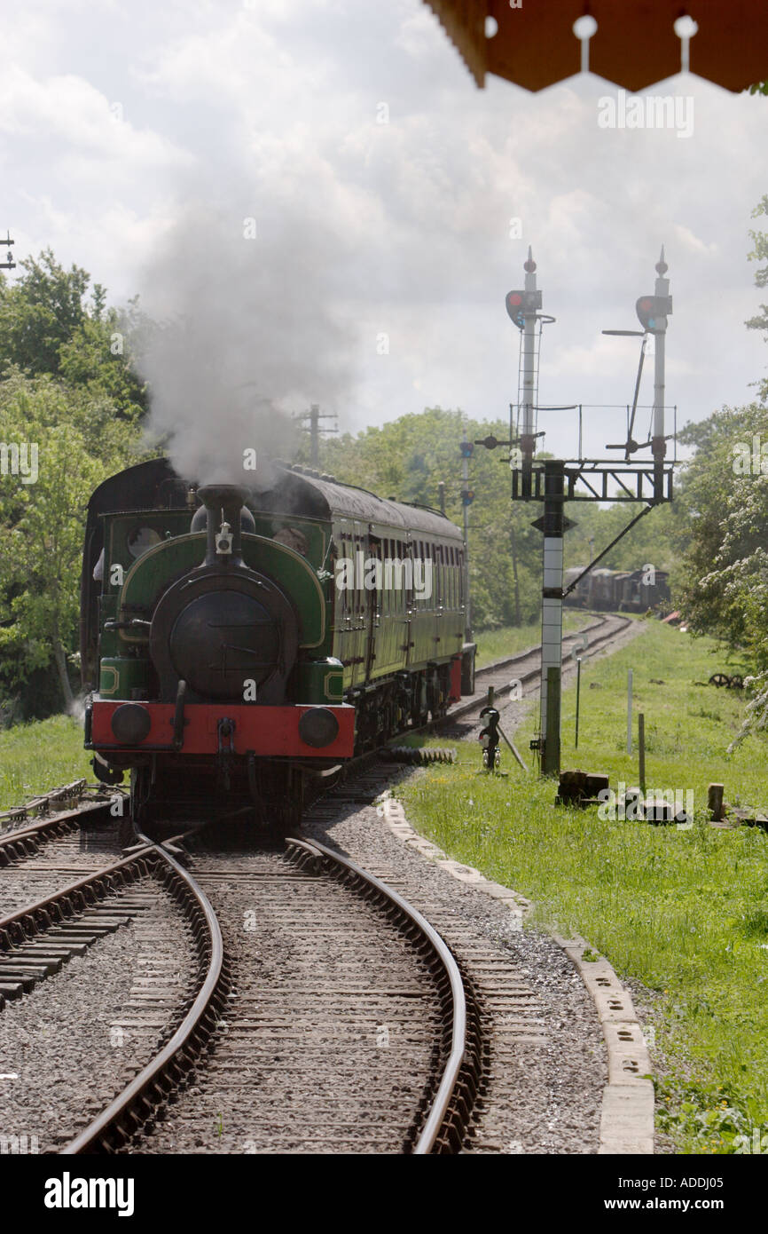 Train pulls into platform of preserved railway station Stock Photo - Alamy