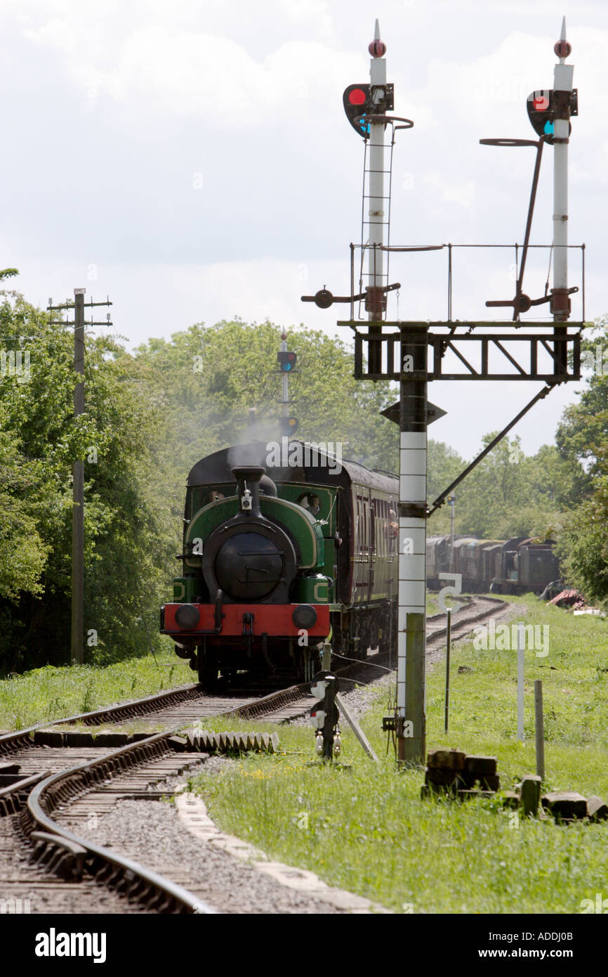 Train pulls into platform of preserved railway station Stock Photo - Alamy