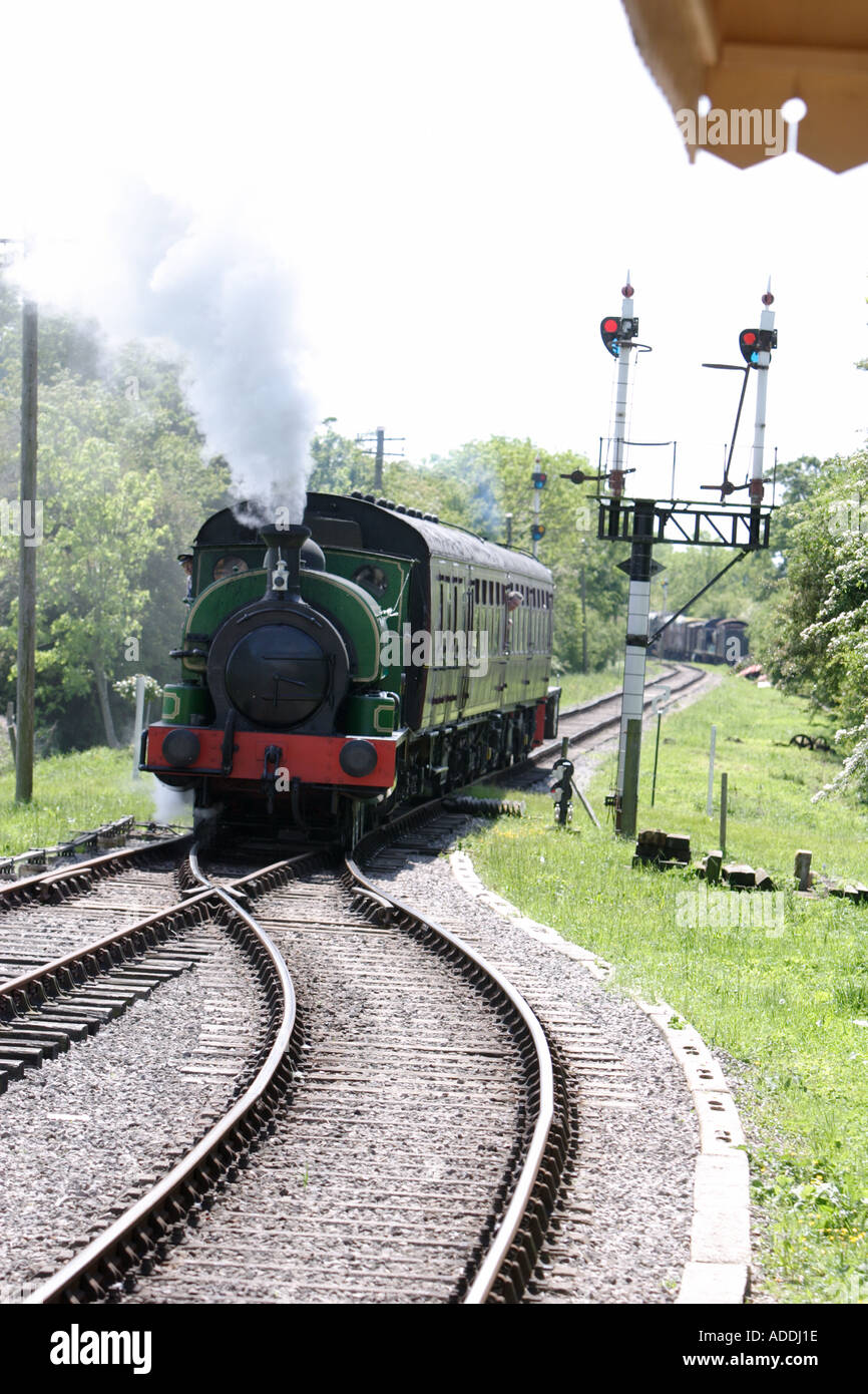 Train pulls into platform of preserved railway station Stock Photo - Alamy