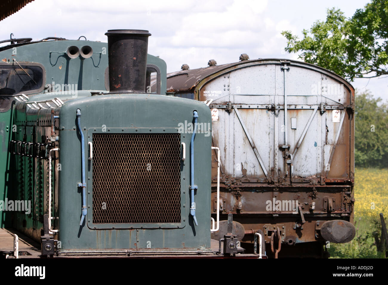 Train pulls into platform of preserved railway station Stock Photo - Alamy