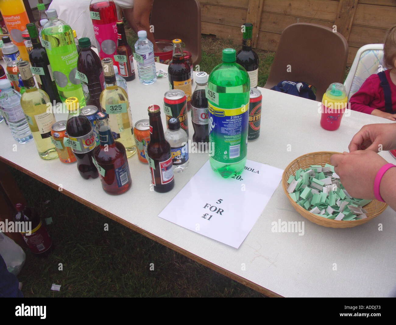 Folding up raffle tickets Butley Flower Show fete Suffolk England Stock ...