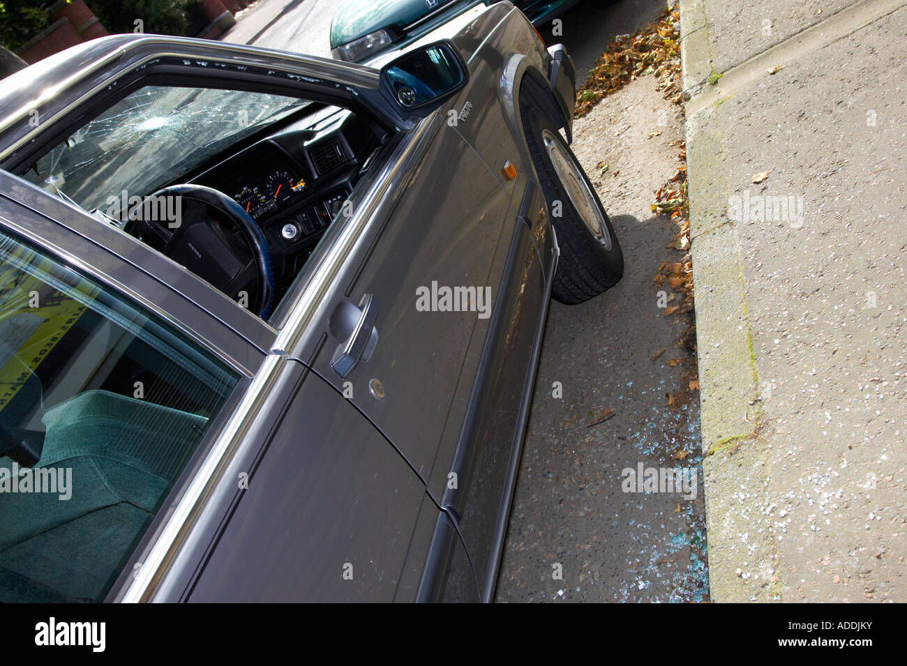 volvo car with smashed windshield and broken drivers door window with ...