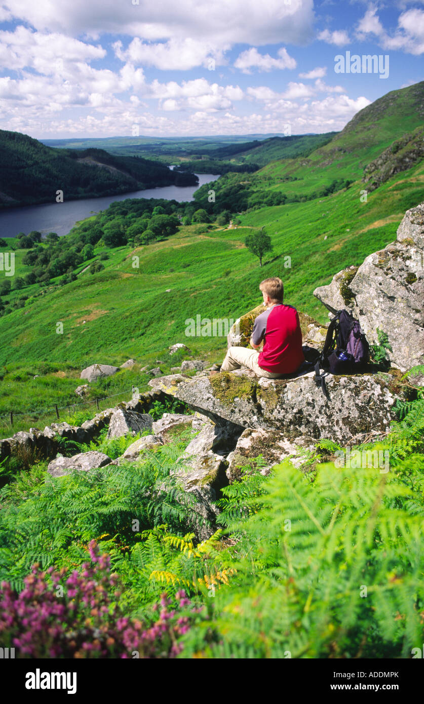 Hill walking summer male hill walker sitting enjoying the view down ...