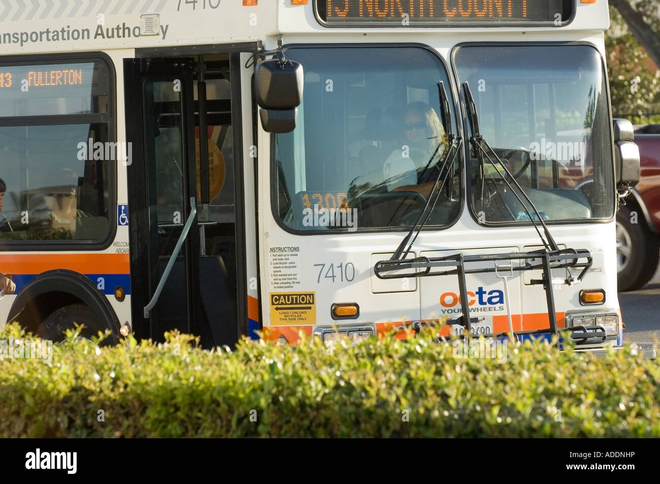 Bus stops to pick up passengers in Orange County California Stock Photo ...