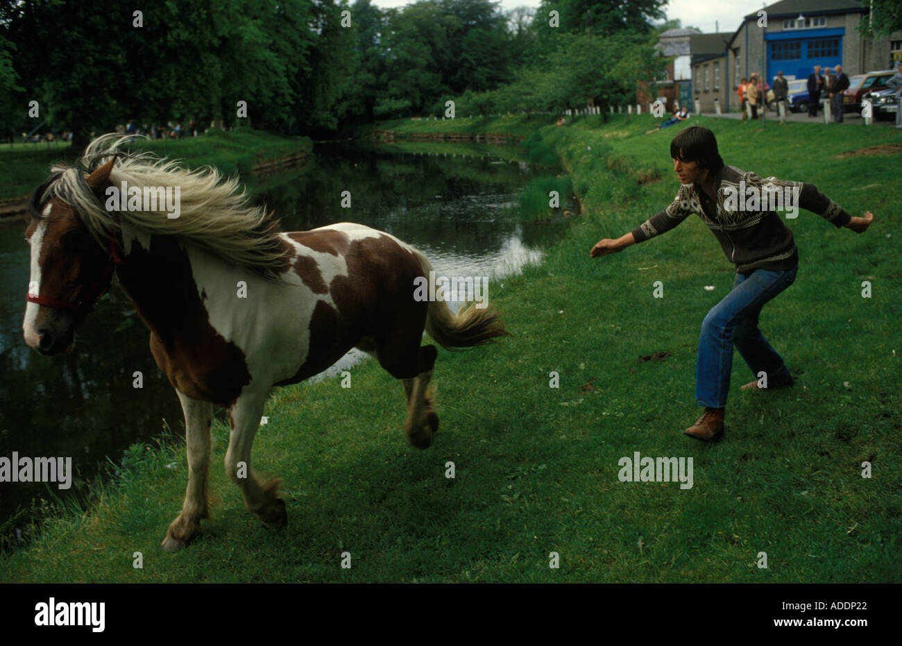 Teen gypsy boy young man trying to catch hose to wash in River Eden ...