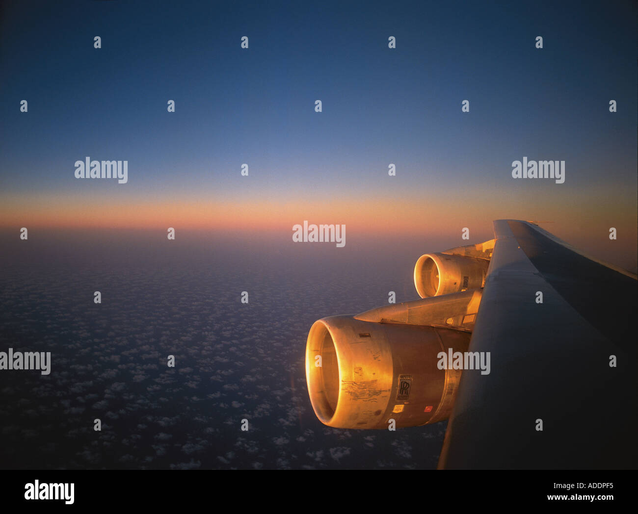 Engine in the warm sunlight from below just before sunset obove small ...