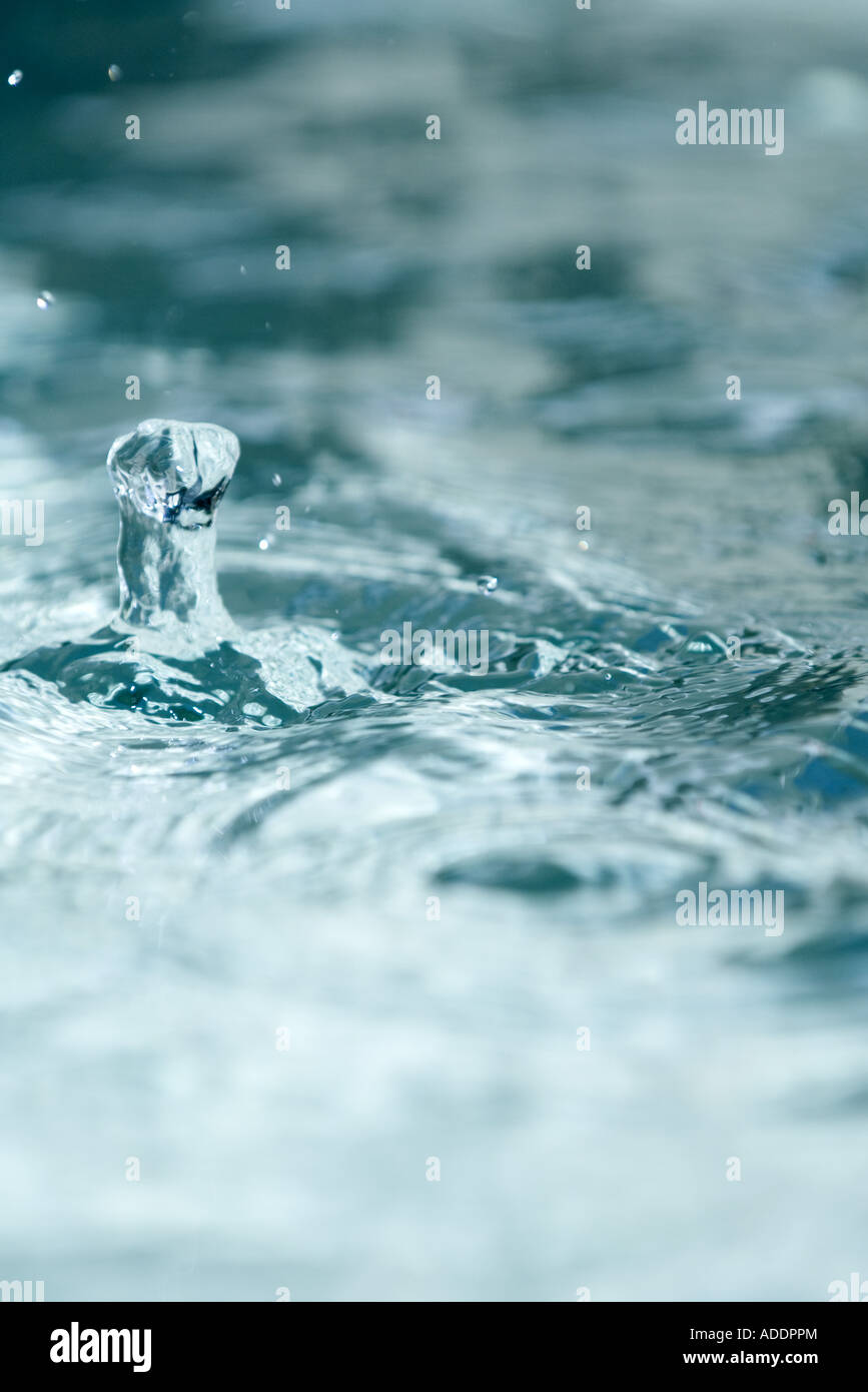 Drops of water hitting surface of water Stock Photo - Alamy