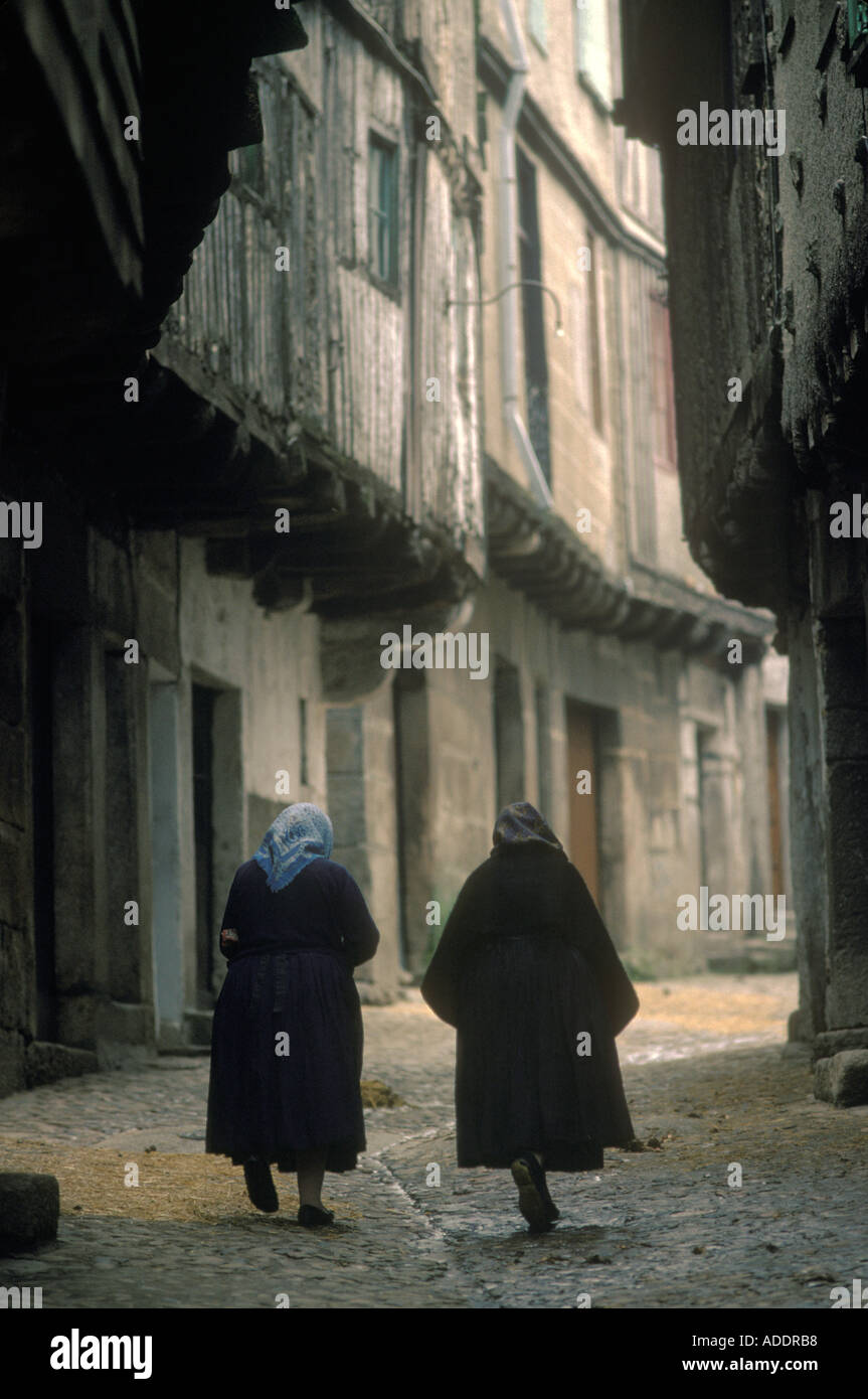 Spain poverty, old women pass time of day dressed in black clothing ...