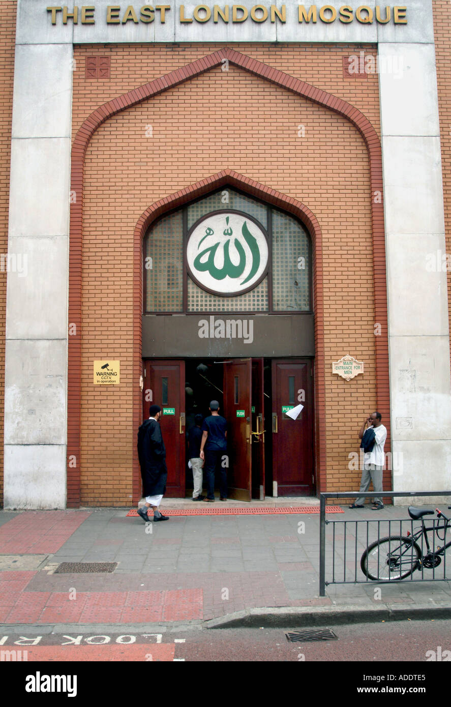 MEMBERS OF THE MUSLIM ETHNIC COMMUNITY ENTERING TO THE EAST LONDON ...