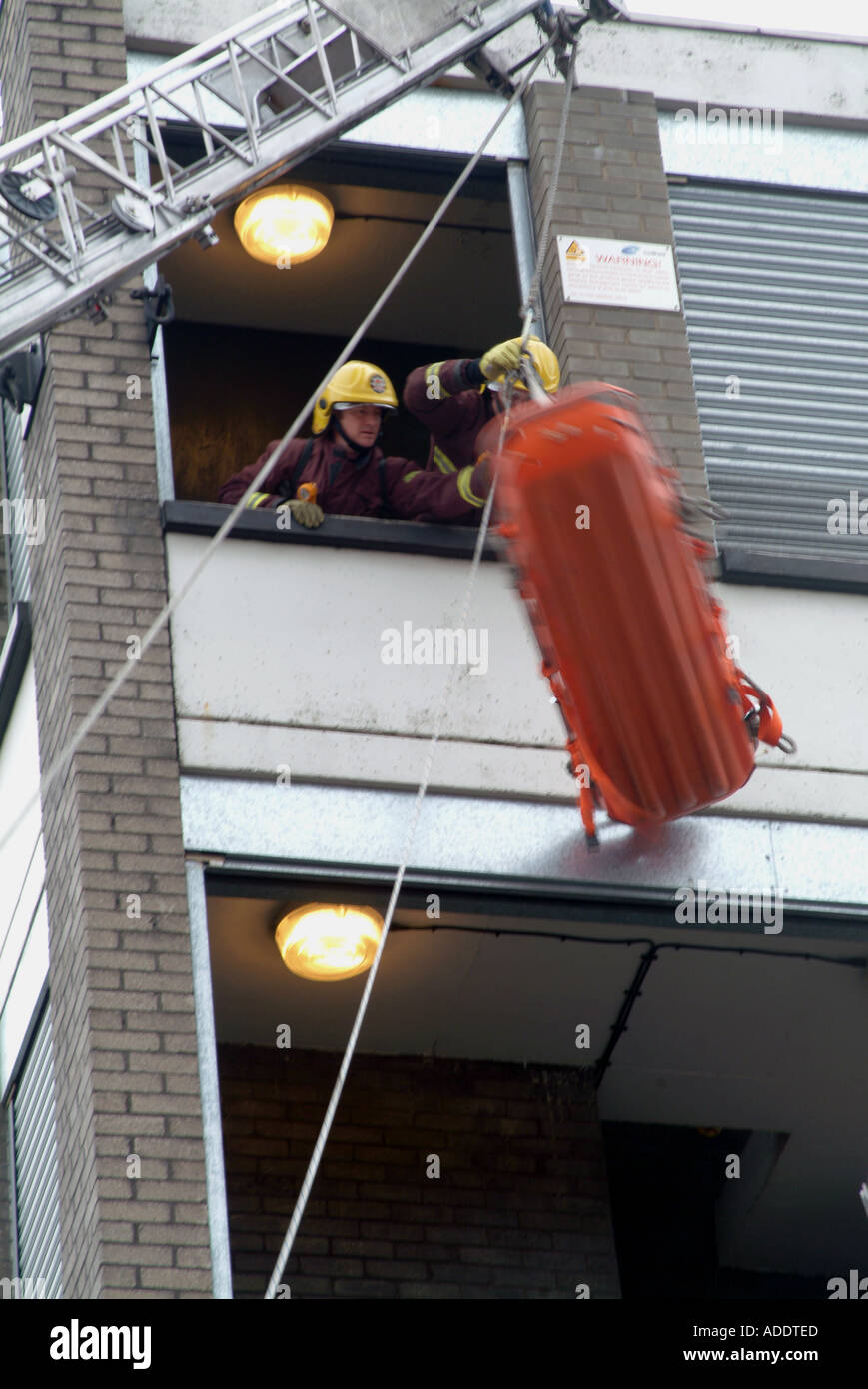 TWO FIREMAN IN A RESCUE OPERATION PRACTISE JUNE 2005 Stock Photo - Alamy